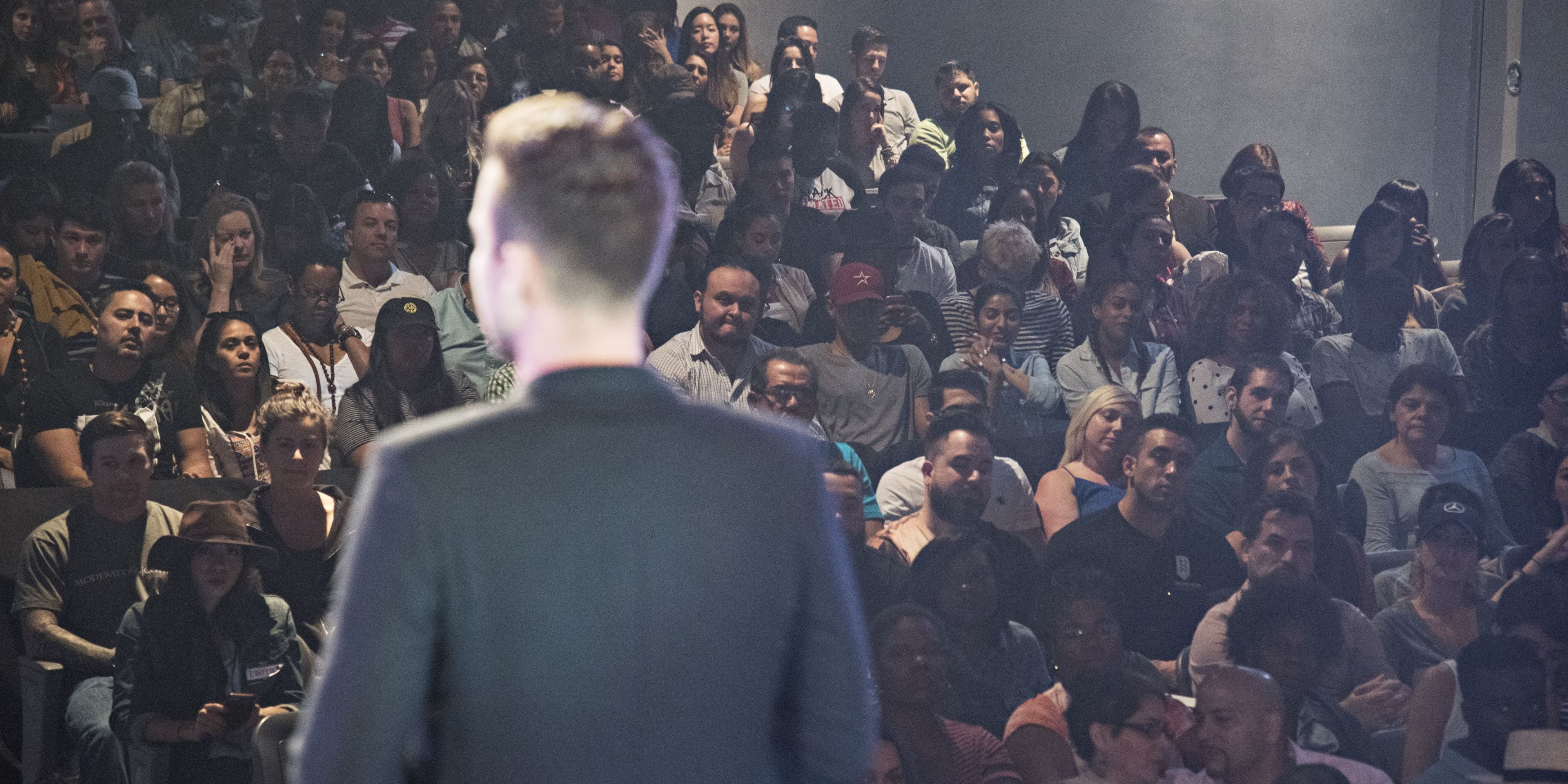 Pastor Preaching To Crowd